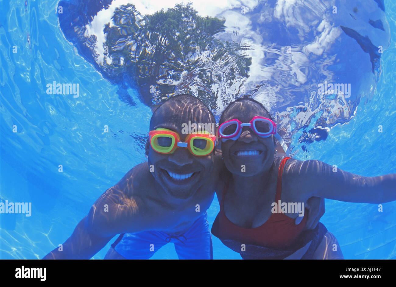 Adult couple in swimming pool Stock Photo - Alamy