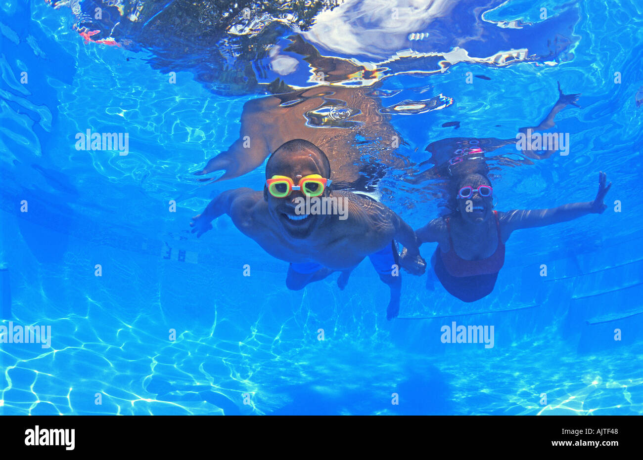 Adult couple in swimming pool Stock Photo - Alamy