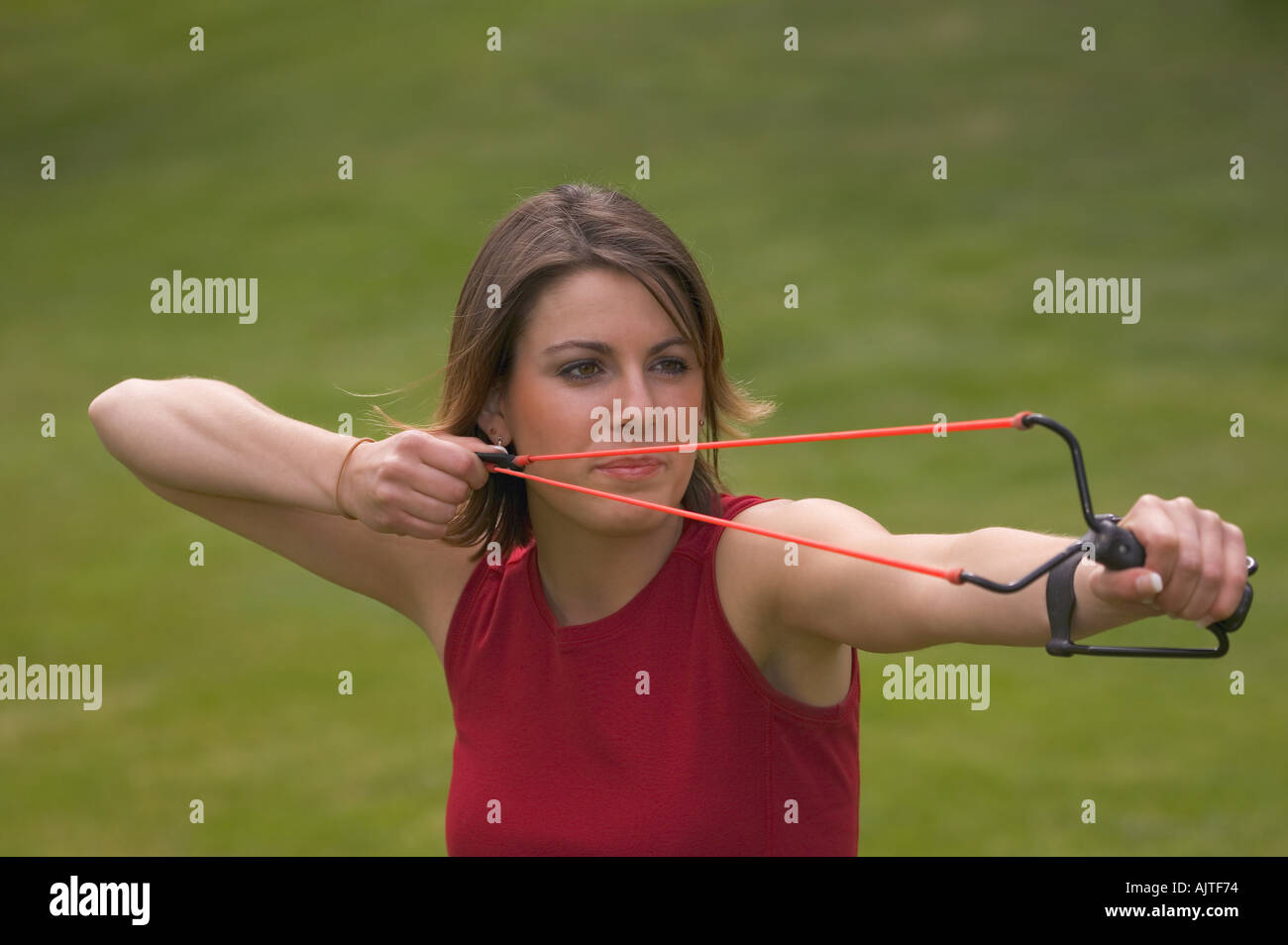 Woman with slingshot Stock Photo - Alamy