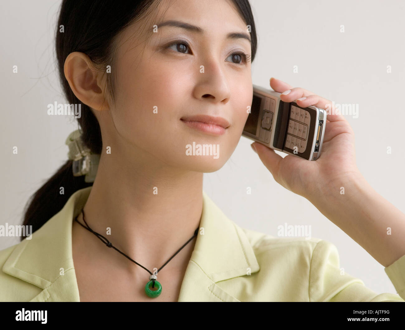 Close-up of a young woman using a mobile phone Stock Photo - Alamy