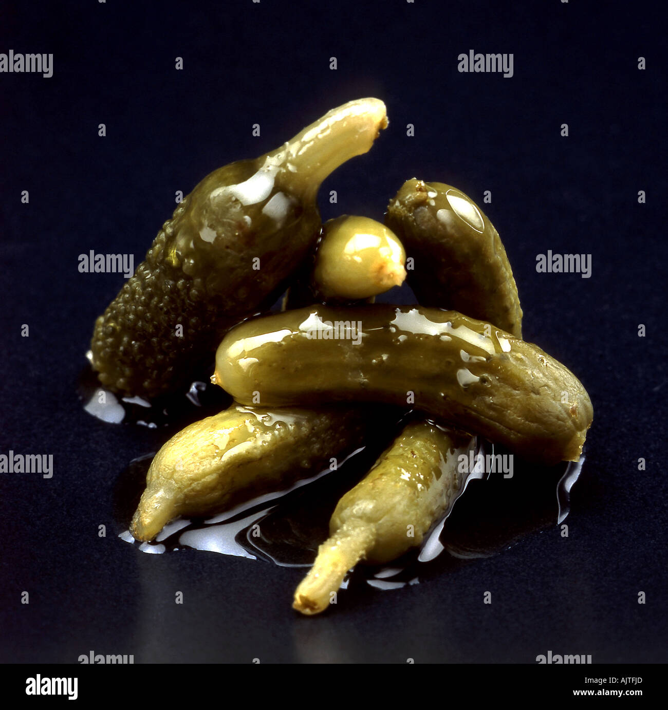 Pickles on black background Stock Photo - Alamy