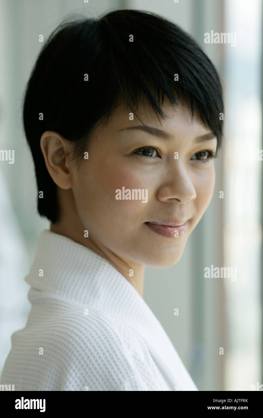 Side profile of a young woman smiling Stock Photo - Alamy