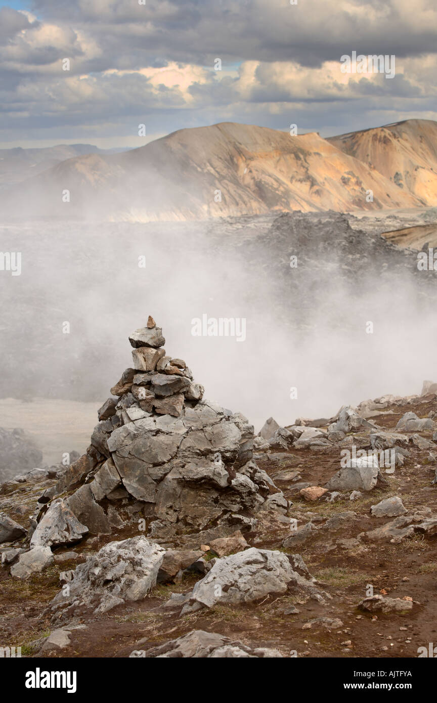 A stack of rocks near a geothermal steam vent in Landmannalaugar ...