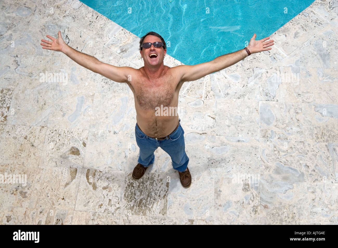 View looking down on a man with his arms outstretched Standing by a ...