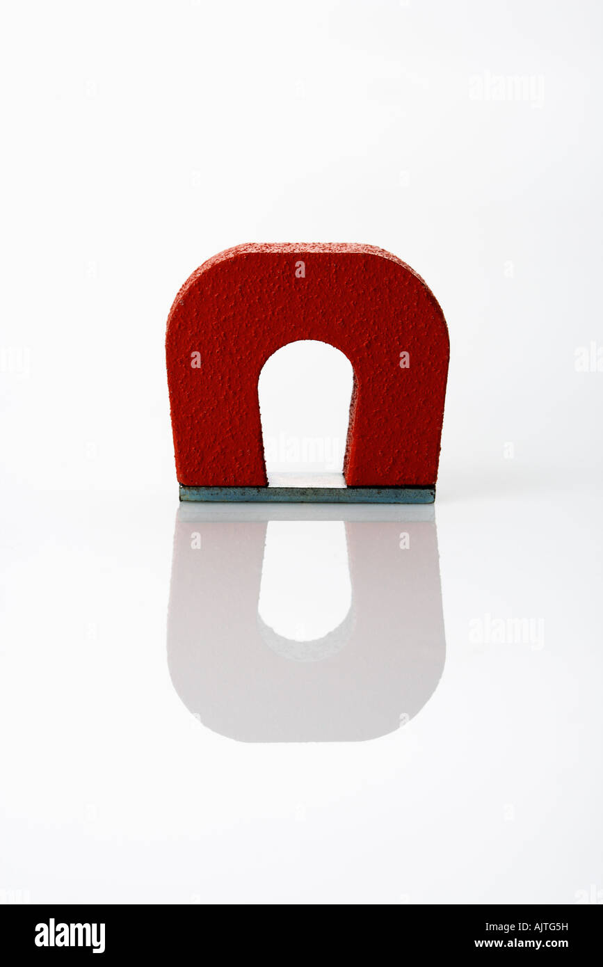 Red magnet on white background Stock Photo - Alamy