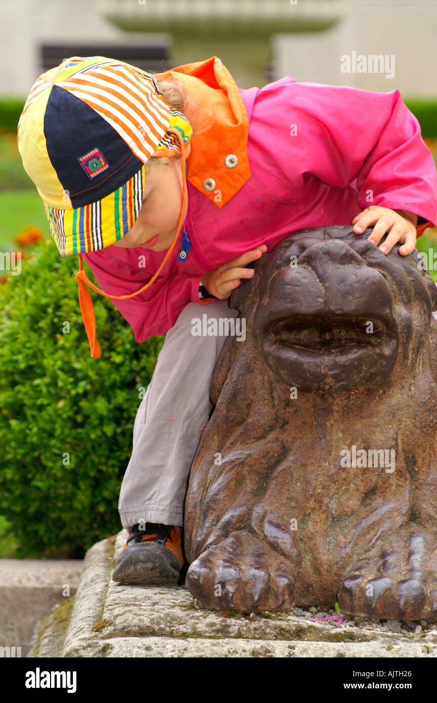 Girl riding a Lion Stock Photo - Alamy