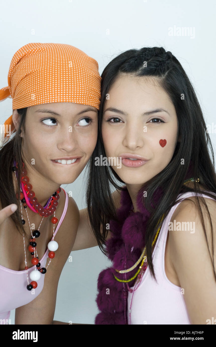 Two young female friends with cheeks together, portrait Stock Photo - Alamy