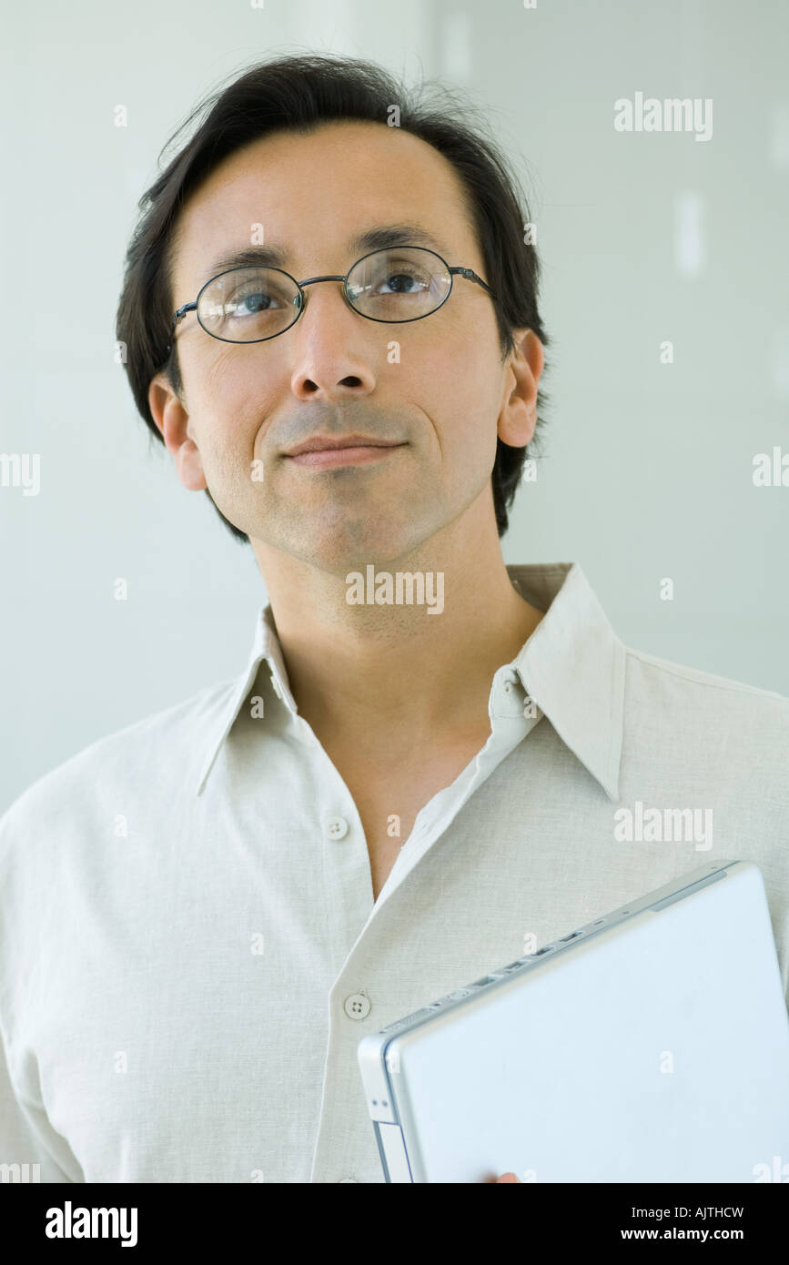 Man looking up, smiling, portrait Stock Photo - Alamy