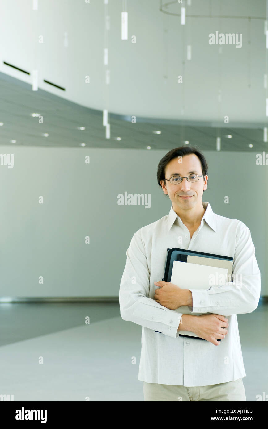 Man standing, smiling at camera, portrait Stock Photo - Alamy