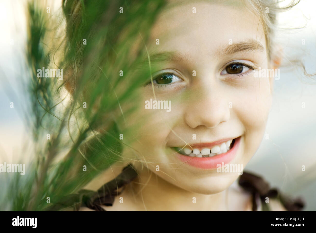 Girl smiling at camera, portrait Stock Photo - Alamy