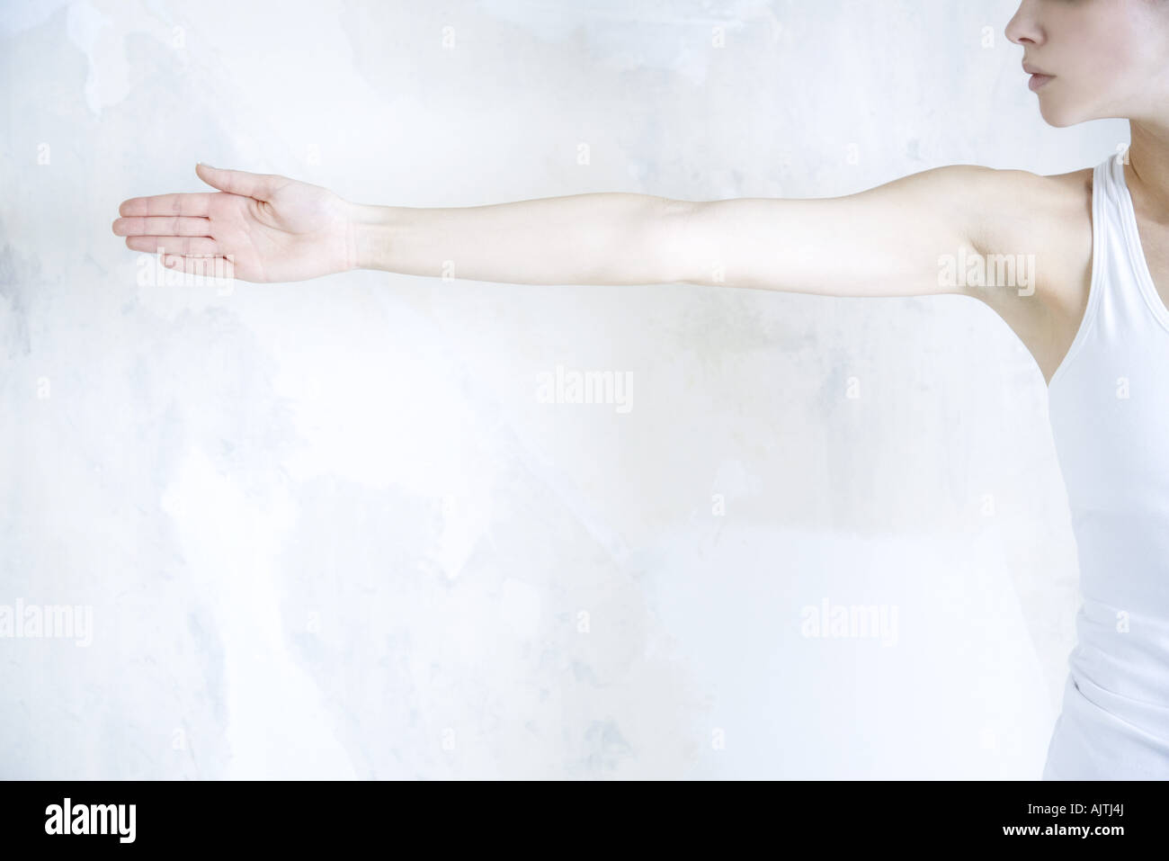 Cropped view of woman standing, arm outstretched Stock Photo - Alamy