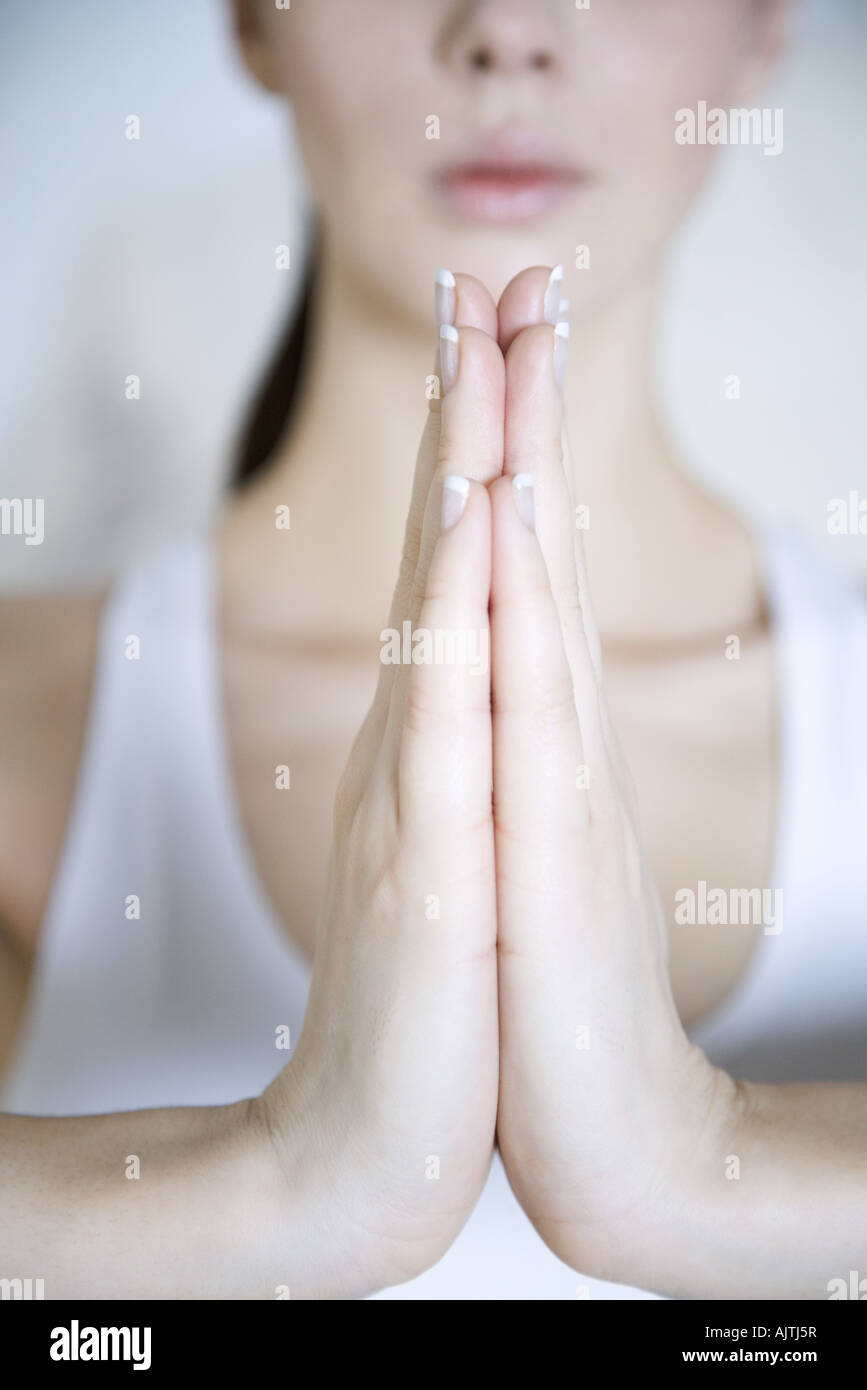 Woman in prayer position, cropped view of hands Stock Photo - Alamy
