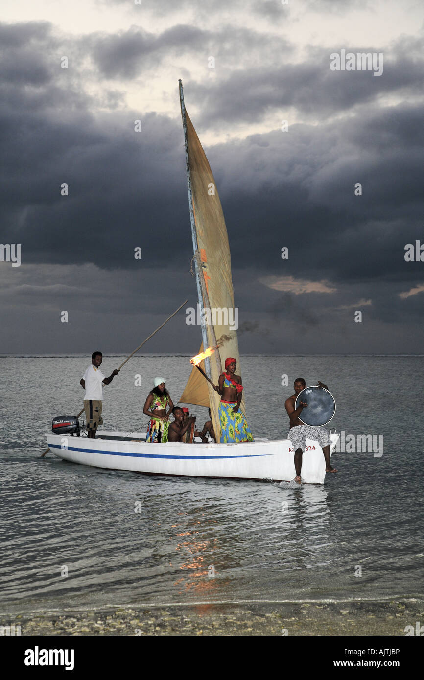 african musician playing percussion on fishing boat Stock Photo - Alamy
