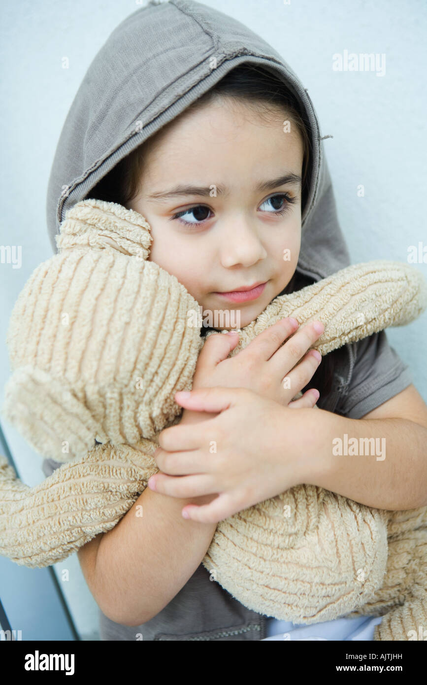 Little girl holding teddy bear, portrait Stock Photo - Alamy