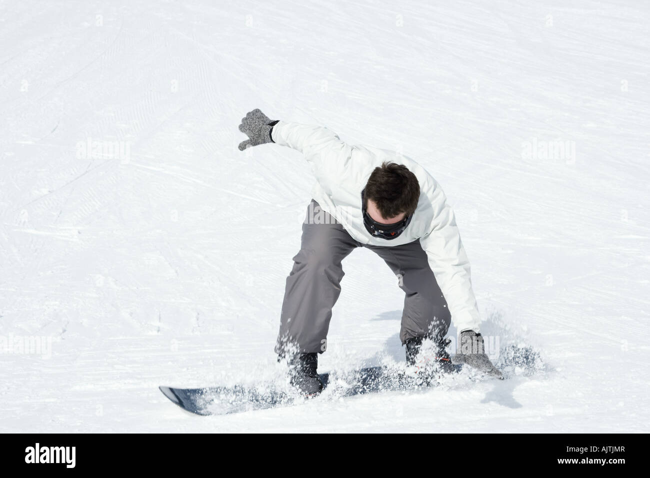 Snowboarding bending forward, trying to keep balance Stock Photo - Alamy