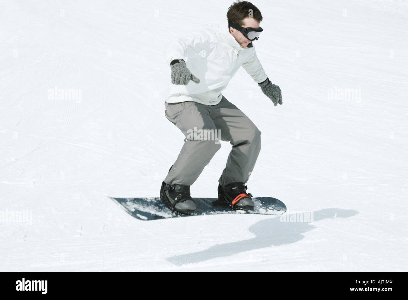 Snowboarder doing trick, full length Stock Photo - Alamy
