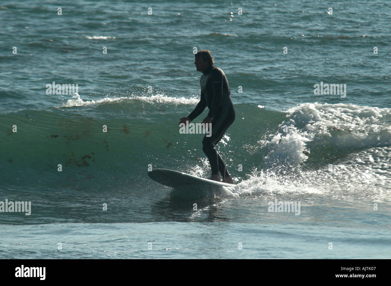 Surfing Down the line Stock Photo - Alamy
