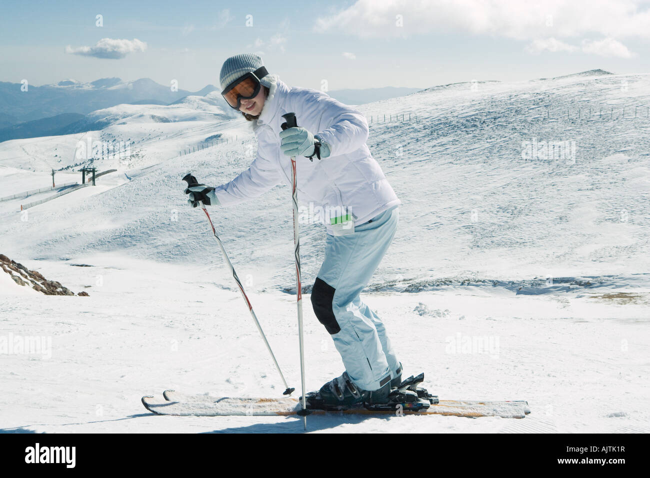 Young skier smiling at camera, full length portrait Stock Photo - Alamy