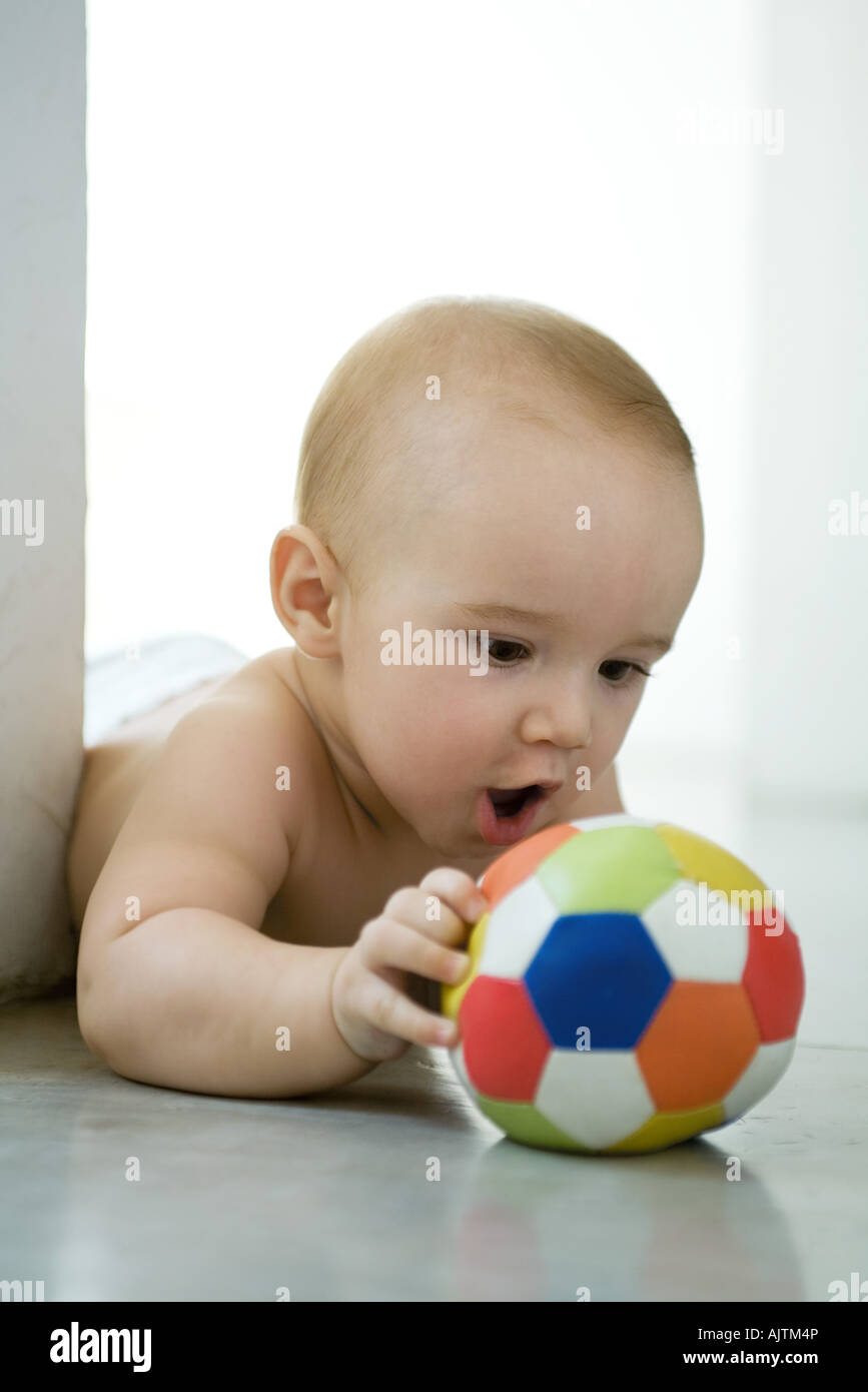 Boy on multicolored ball hi-res stock photography and images - Alamy