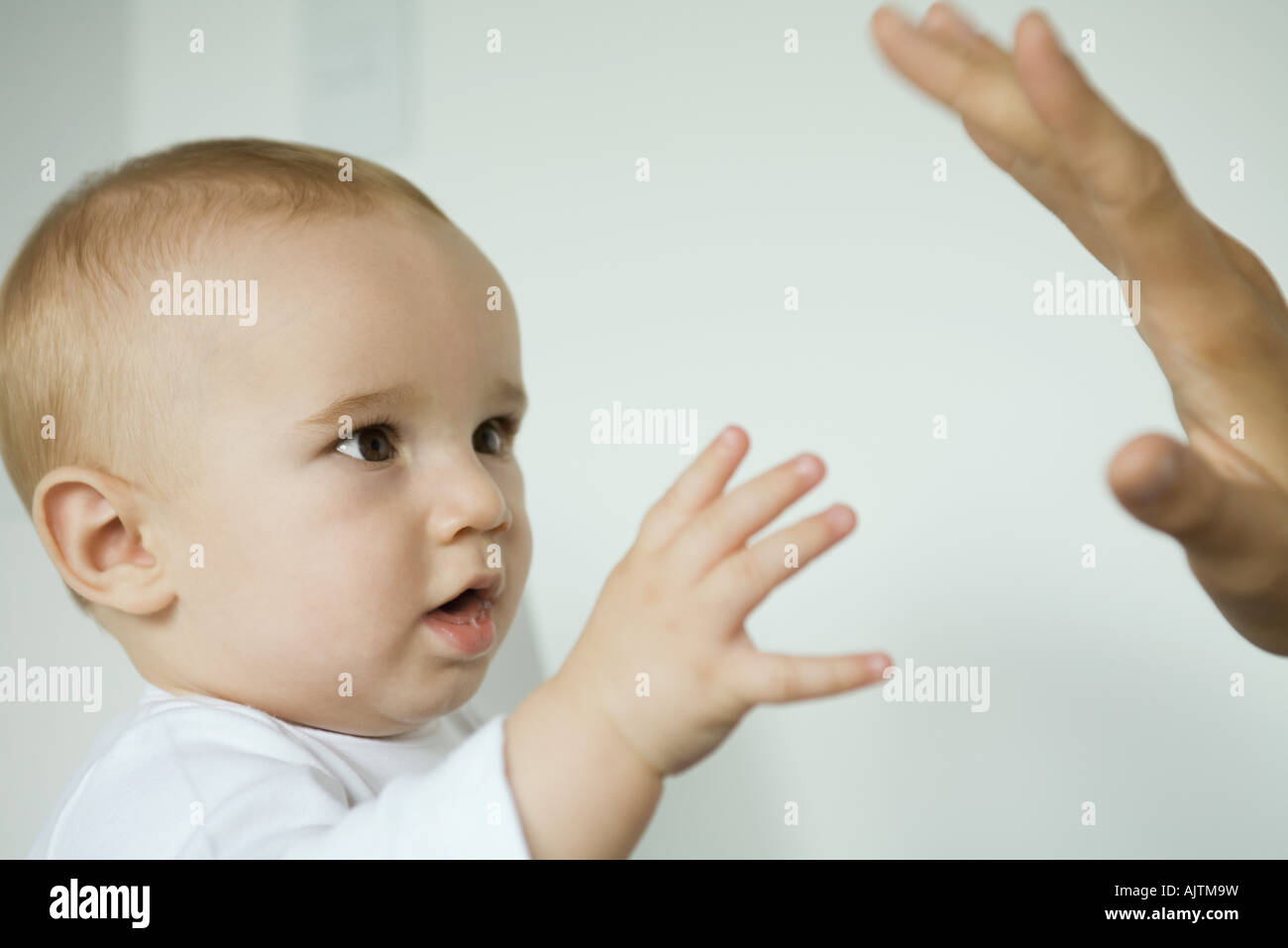 Baby And Reaching Hands Stock Photos & Baby And Reaching Hands Stock ...