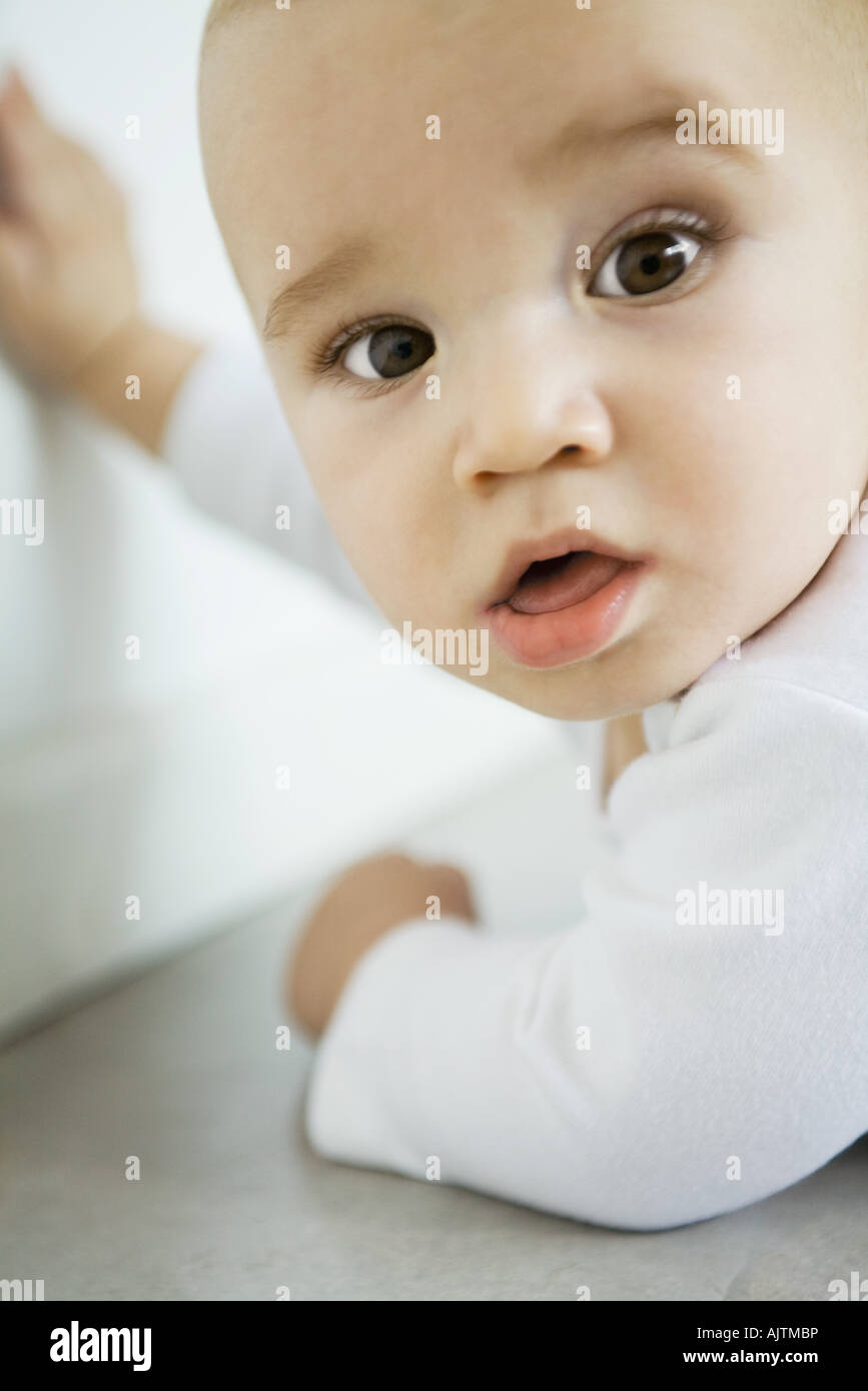 Baby turning head to look at camera, close-up Stock Photo - Alamy