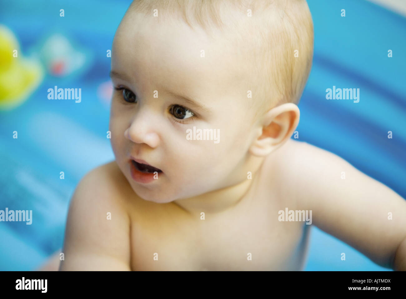 Baby in inflatable baby pool, head and shoulders, close-up Stock Photo ...