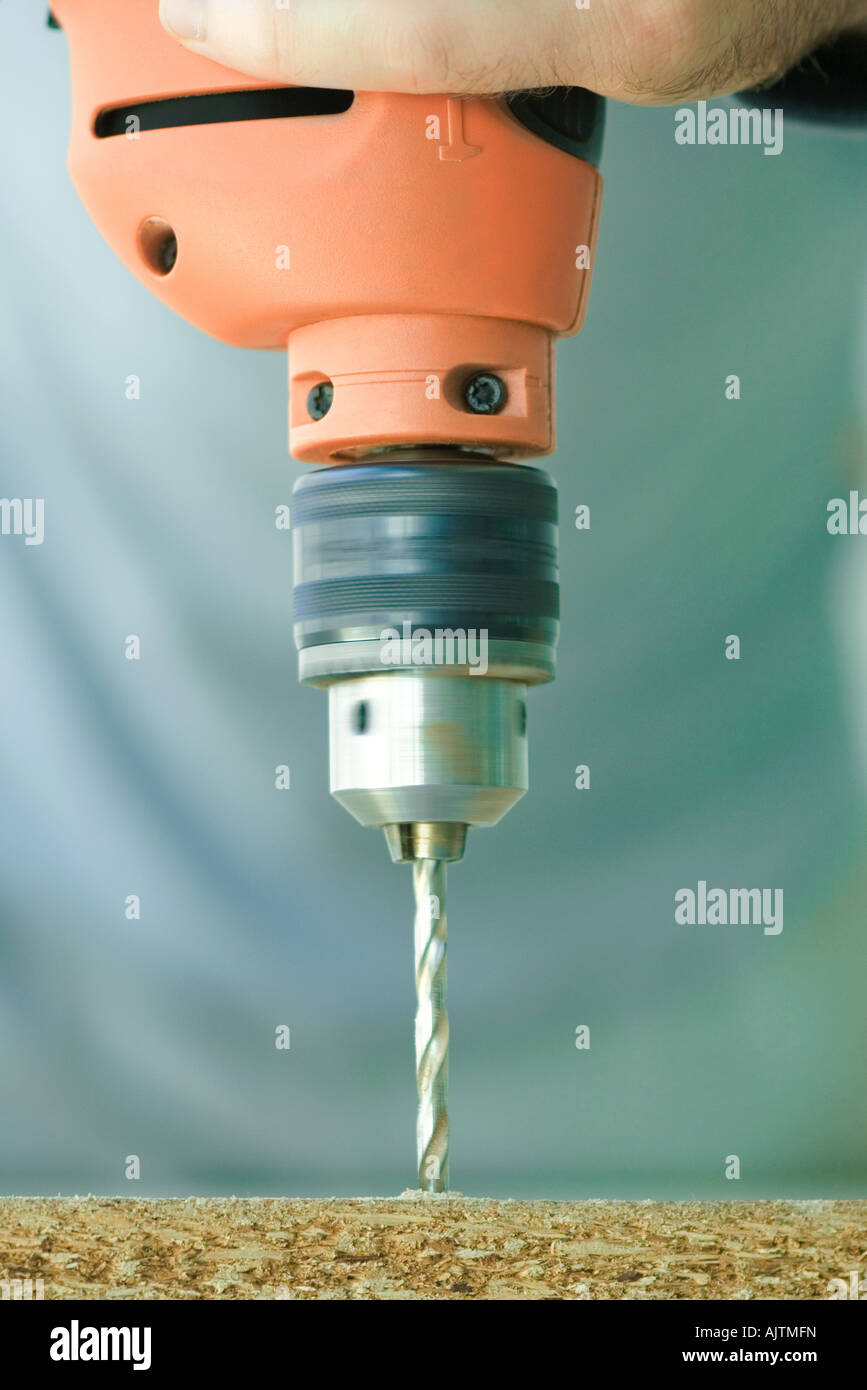 Man using drill, close-up Stock Photo - Alamy