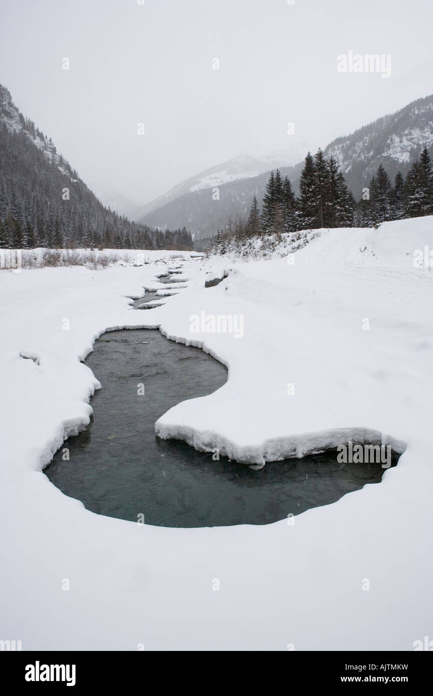 Snow in Mountain Valley, Iced over Stream Stock Photo - Alamy