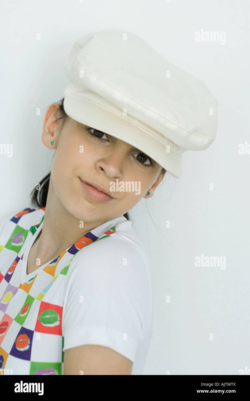 Teenage girl wearing cap, smiling at camera, portrait Stock Photo - Alamy