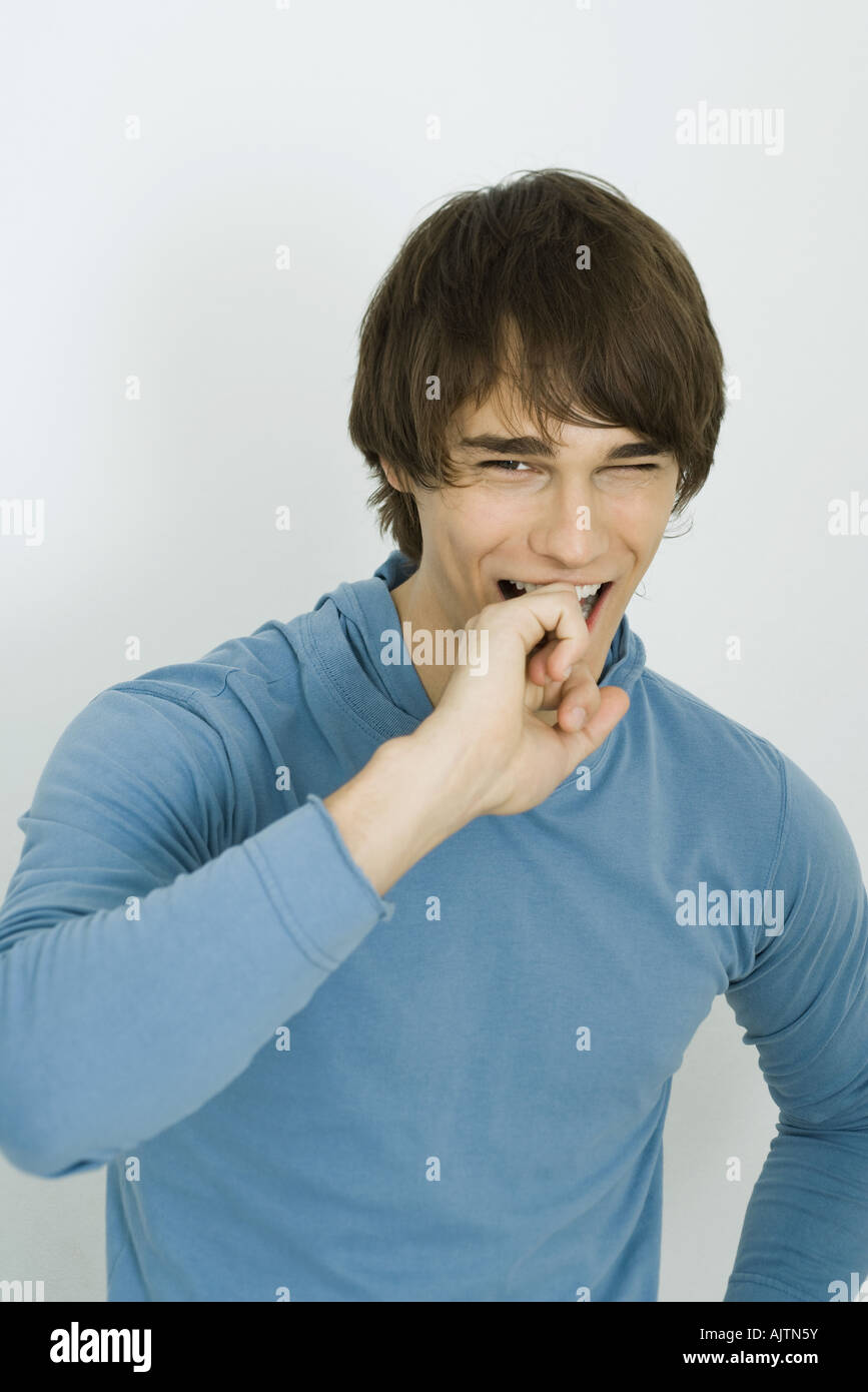 Man biting knuckle hi-res stock photography and images - Alamy