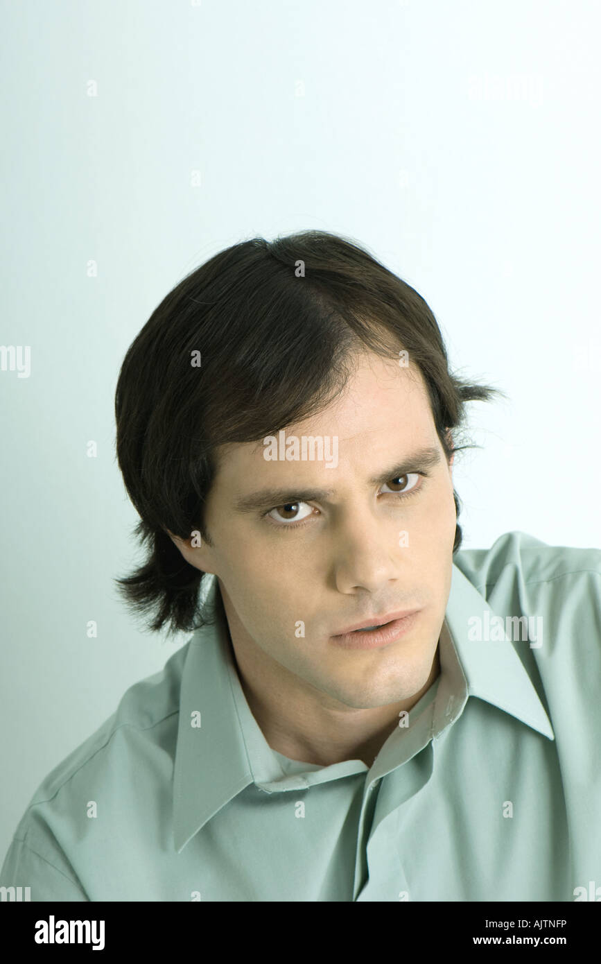 Man glaring at camera, portrait Stock Photo - Alamy