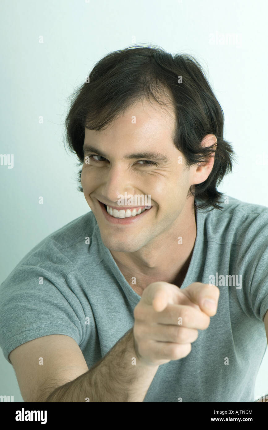 Man smiling, pointing at camera, portrait Stock Photo - Alamy