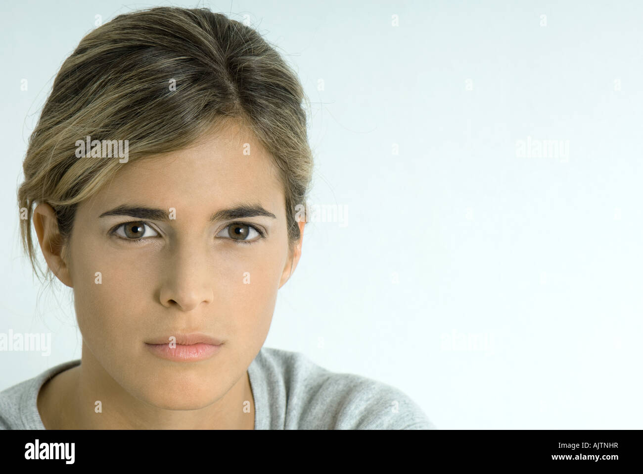 Angry young woman glaring camera hi-res stock photography and images ...