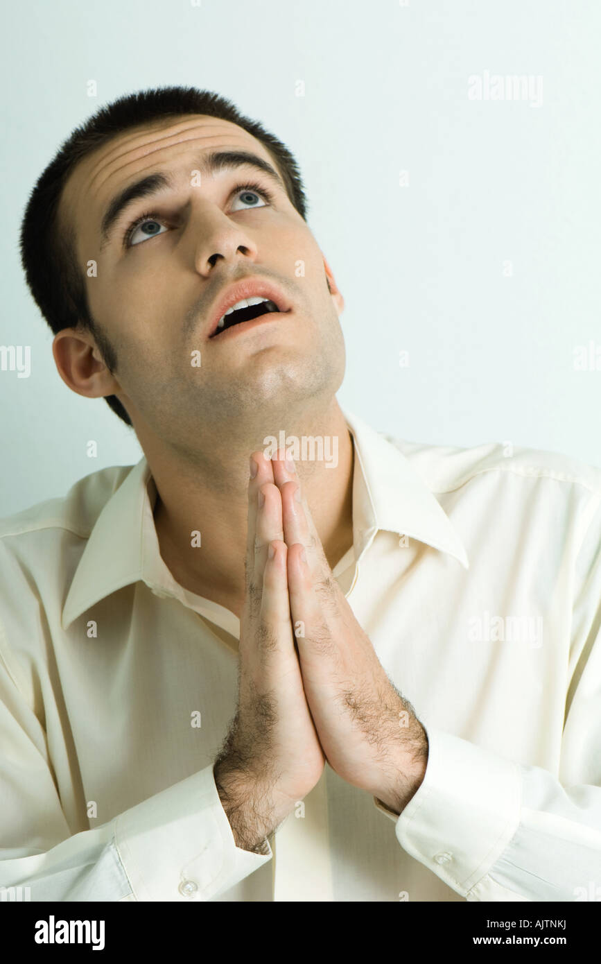 Man praying, looking up Stock Photo - Alamy