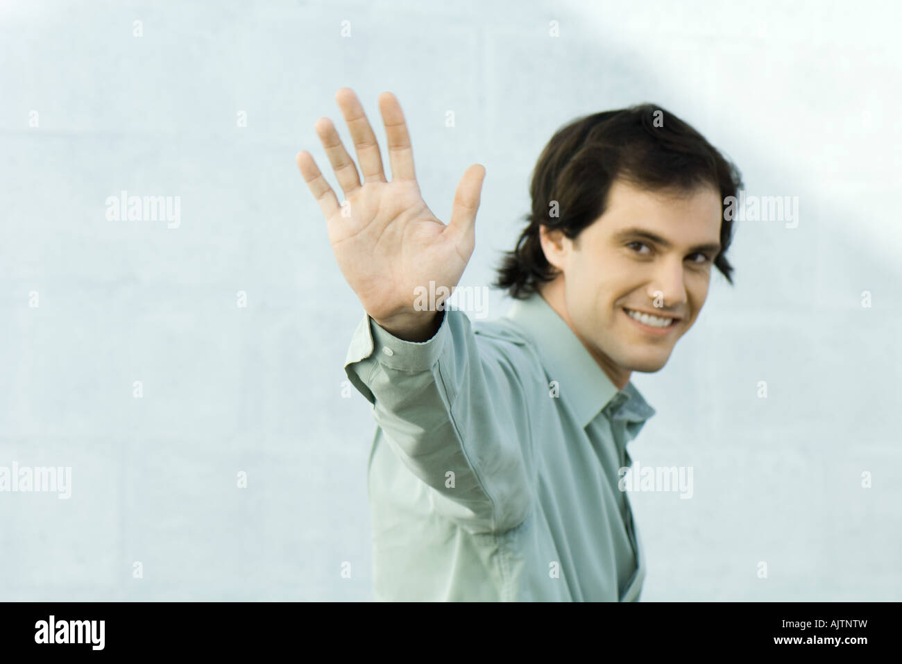 Smiling man greets portrait hi-res stock photography and images - Alamy