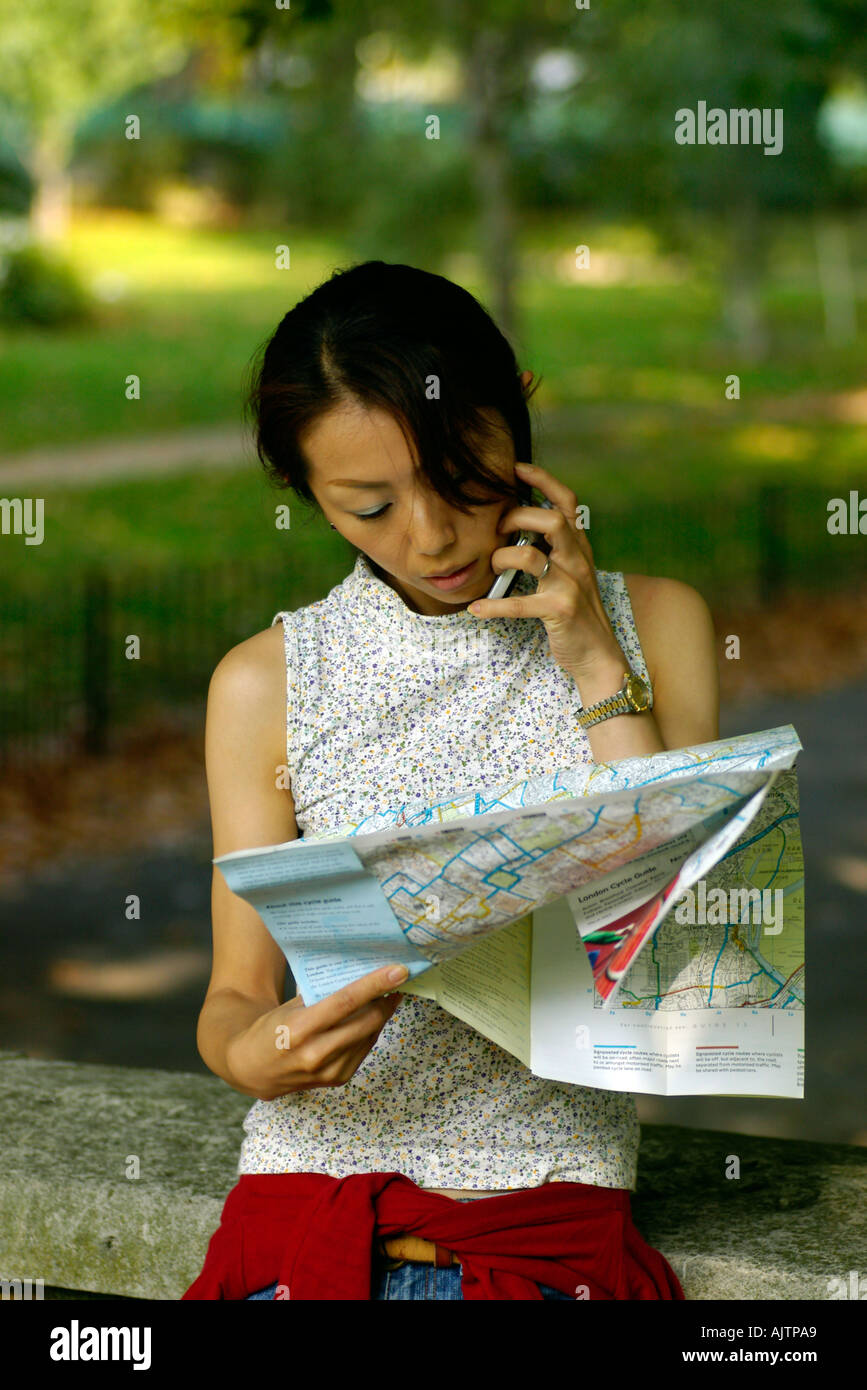 Woman map asking directions hi-res stock photography and images - Alamy