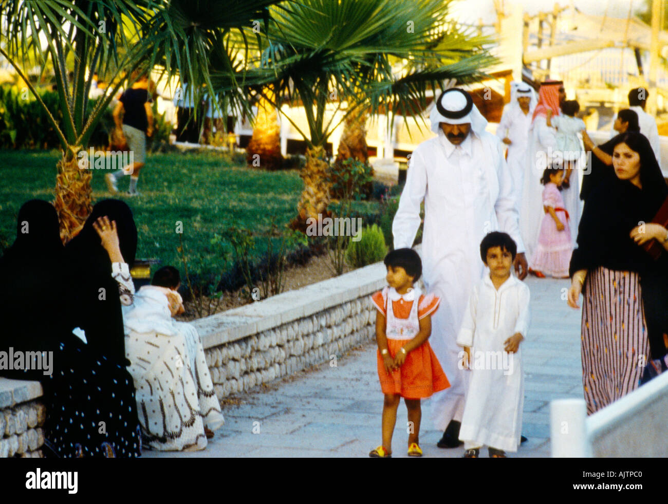 Qatar Family Walking In Park Stock Photo - Alamy