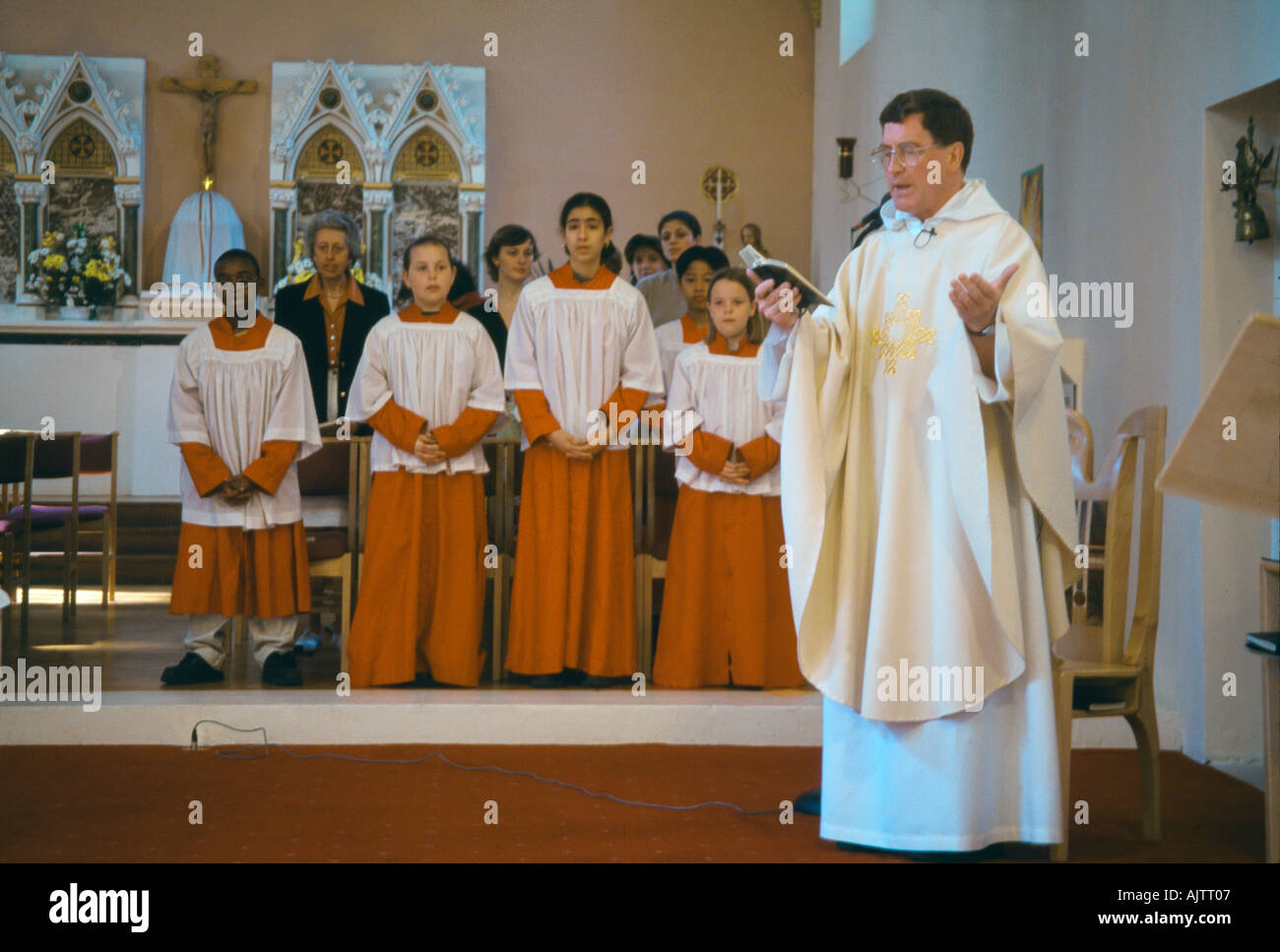 Priest and children hi-res stock photography and images - Alamy