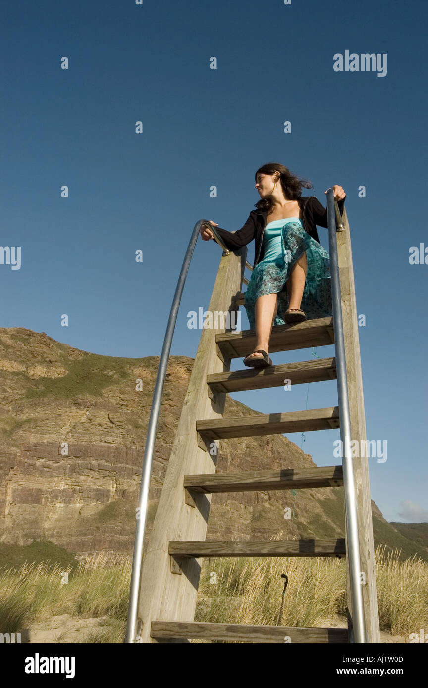 girl sitting on lifeguard steps Stock Photo - Alamy