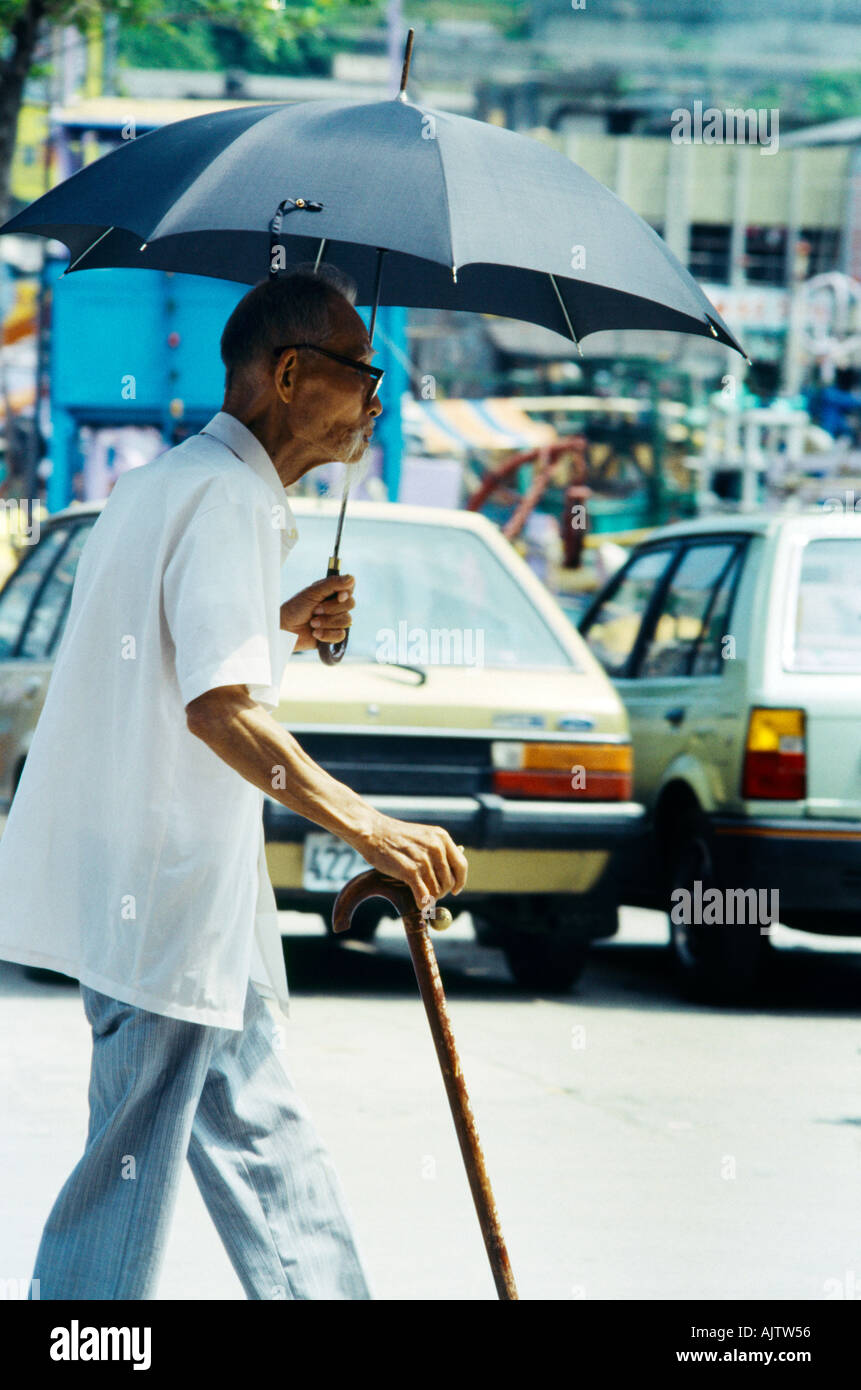 Old man with walking stick hi-res stock photography and images - Alamy