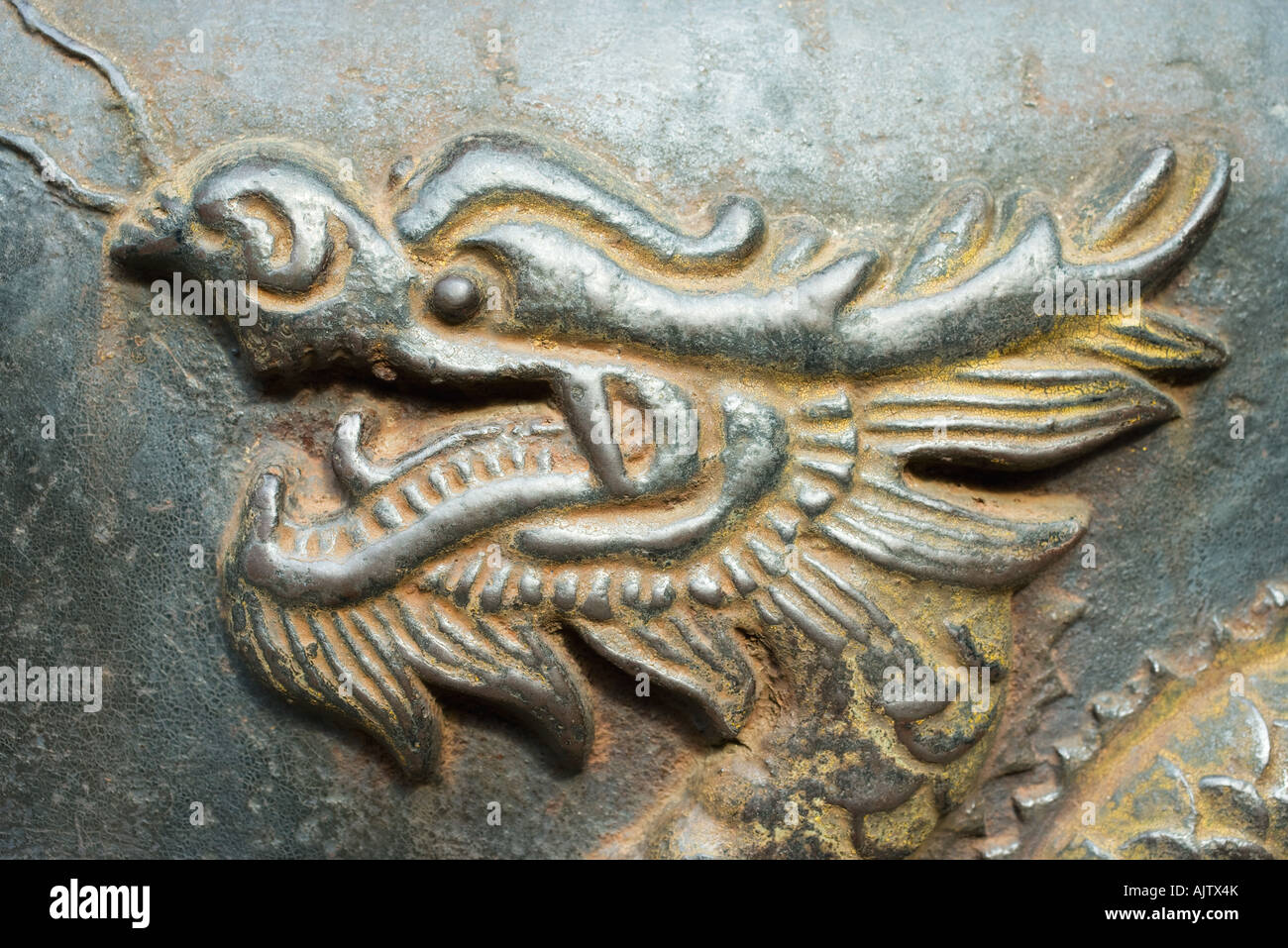 Bronze dragon in relief, close-up Stock Photo - Alamy