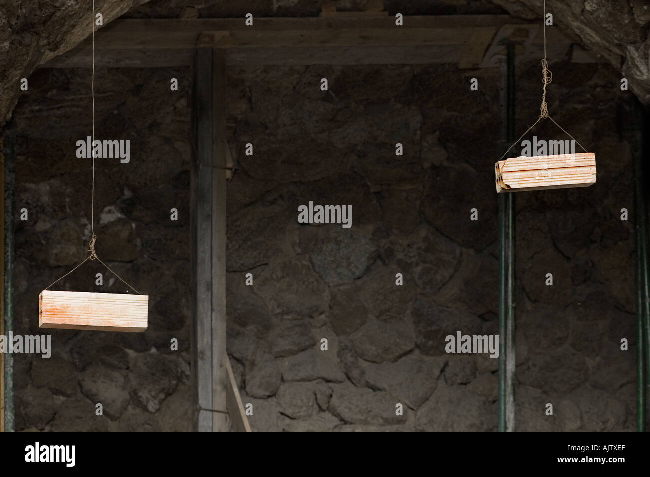 two hanging bricks Stock Photo - Alamy