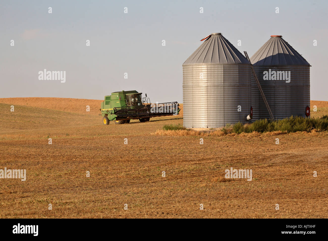 Farmer finished combining field in scenic Saskatchewan Canada Stock ...
