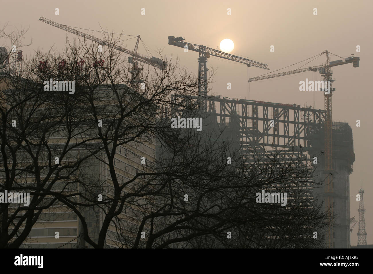The sun sets behind the new Polly Plaza, under construction at ...