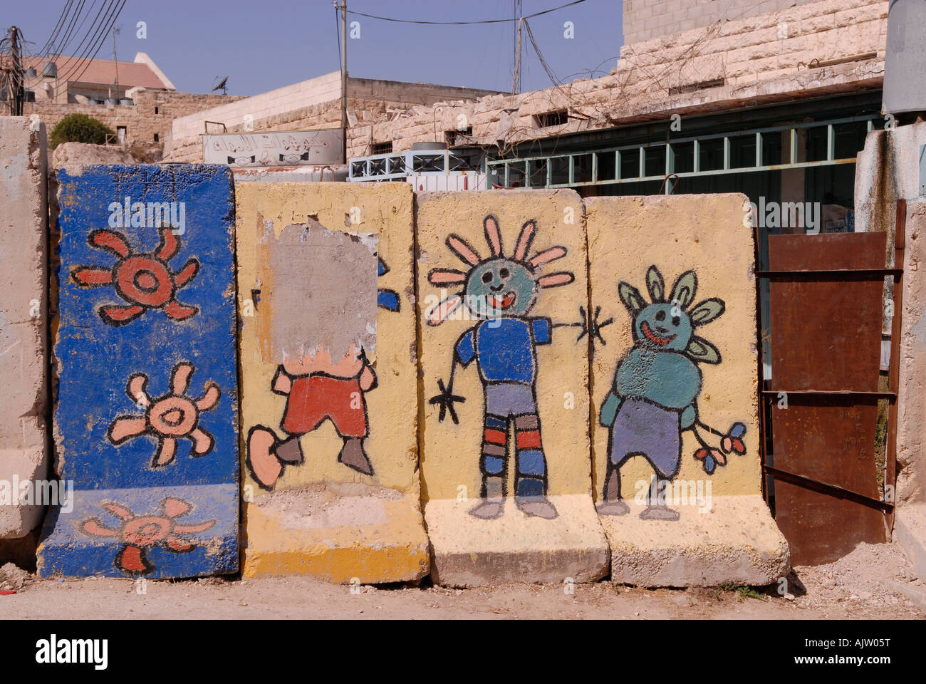 Graffiti decorates concrete slabs separating Israeli and Palestinian ...