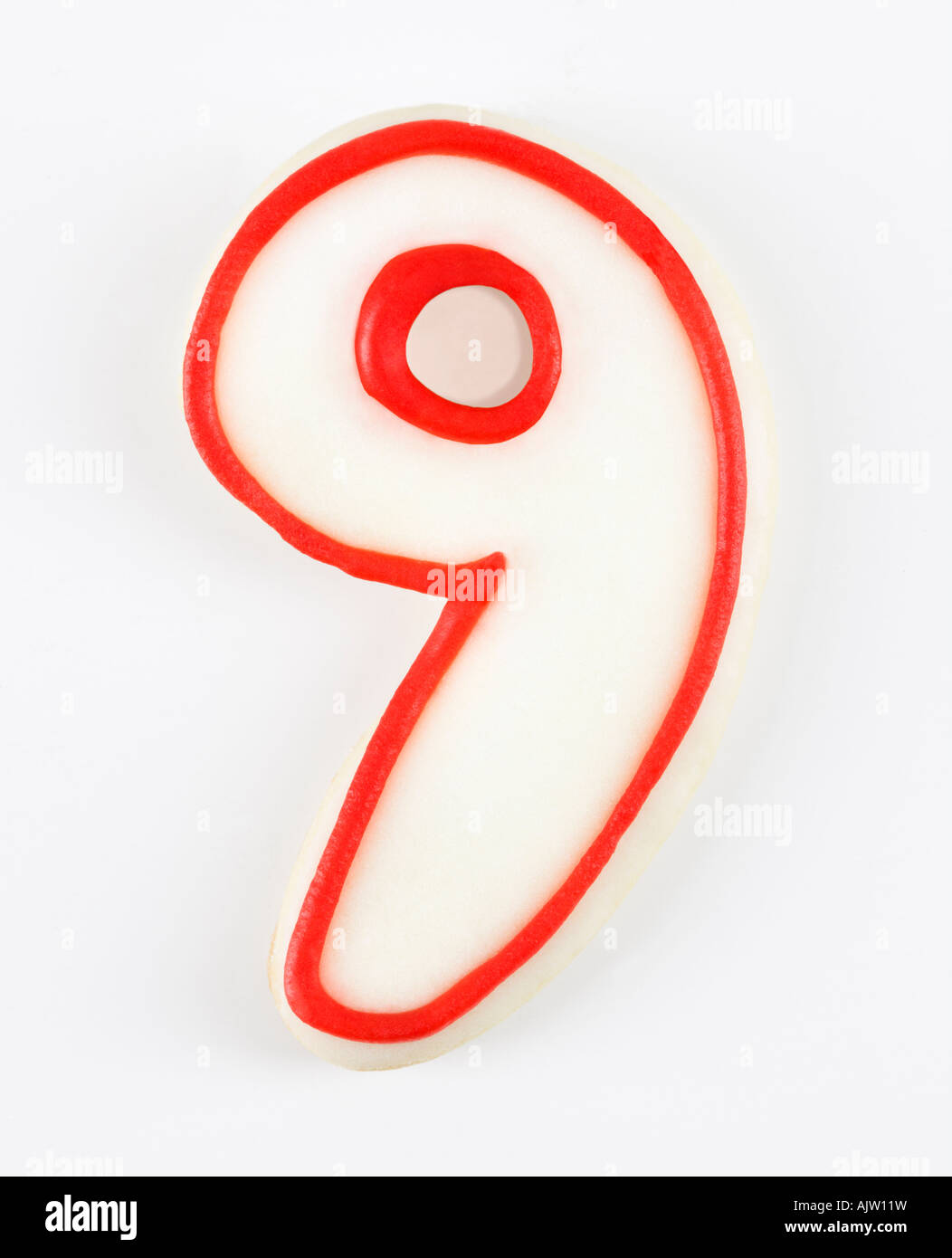 Sugar cookie in the shape of a number nine outlined in red icing Stock ...