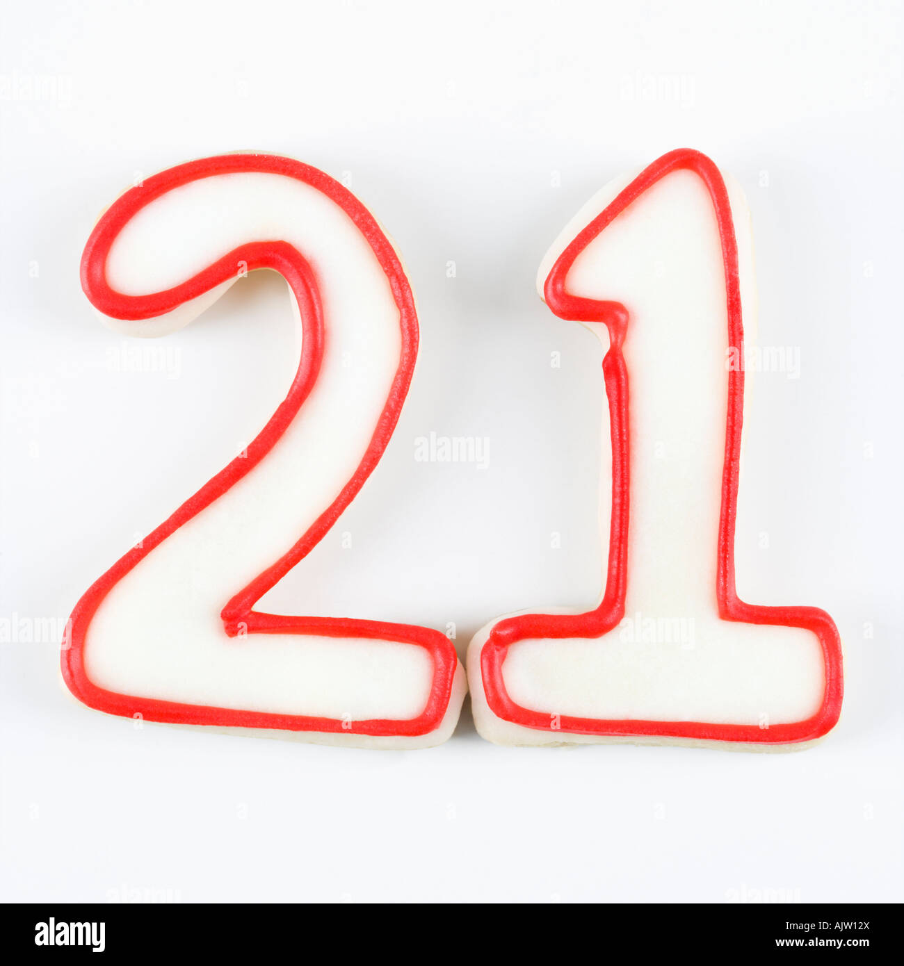 Sugar cookies in the shape of the number twenty one outlined in red ...