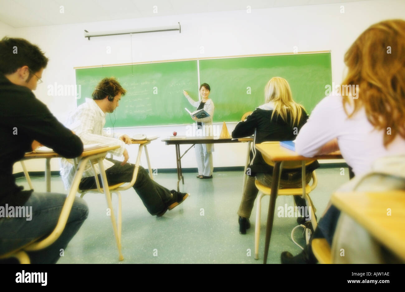 Teacher teaching in classroom Stock Photo - Alamy
