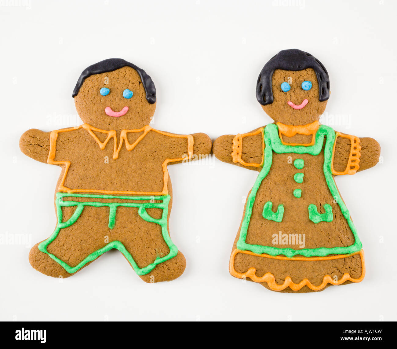 Male and female gingerbread cookies holding hands Stock Photo - Alamy