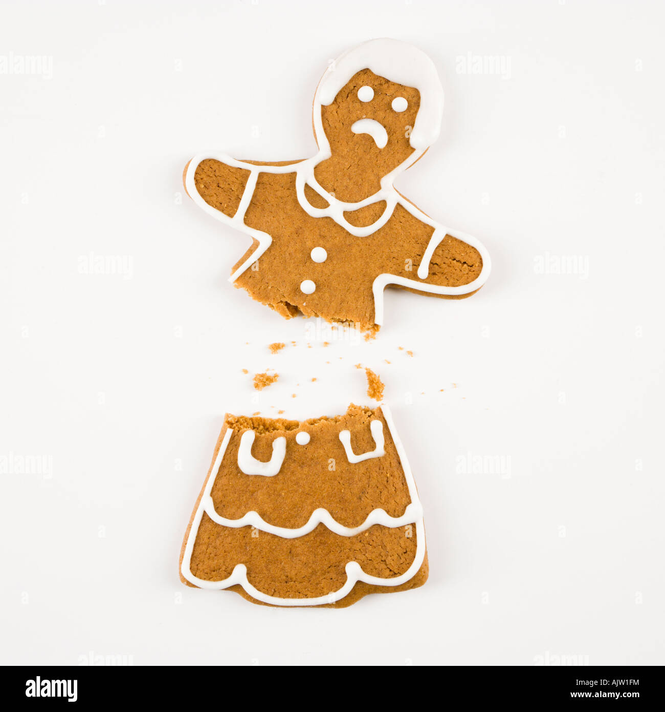 Frowning female gingerbread cookie broken in half Stock Photo - Alamy